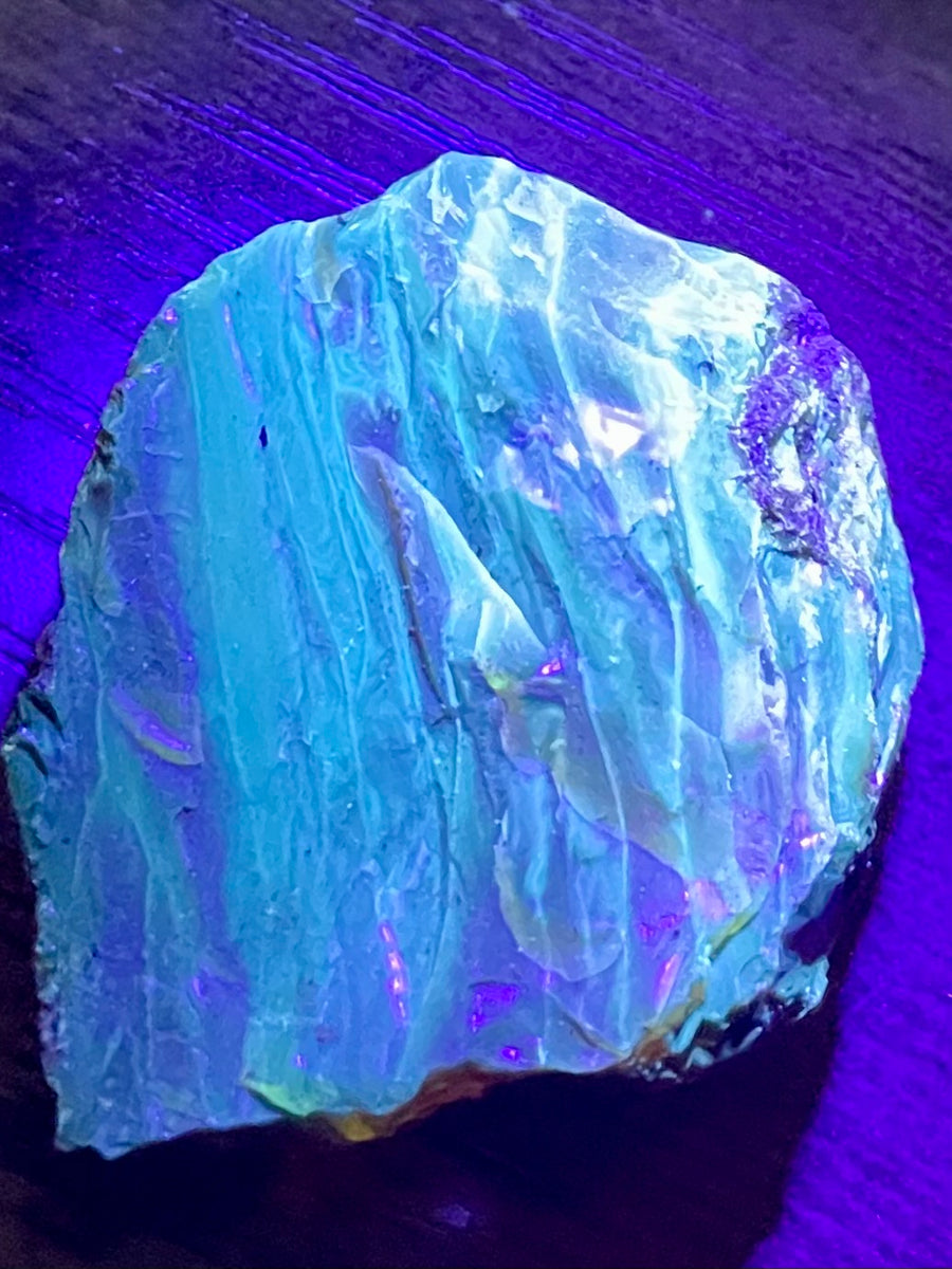Fluorescent Blue Amber Palm Stone